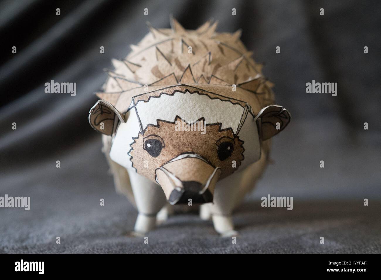 Hedgehog paper craft on grey background Stock Photo - Alamy