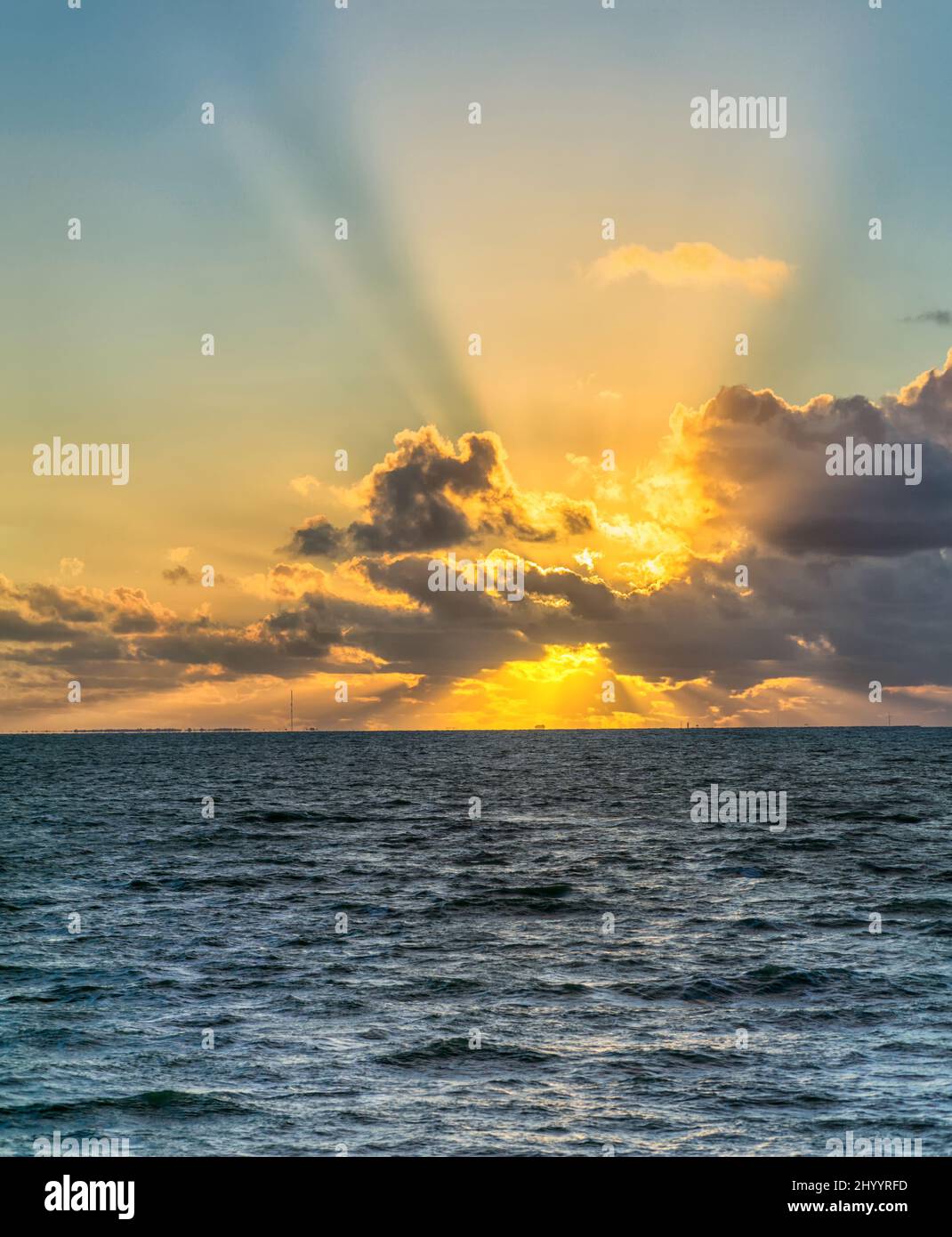 Mesmerizing view of a beautiful seascape at scenic sunset Stock Photo ...