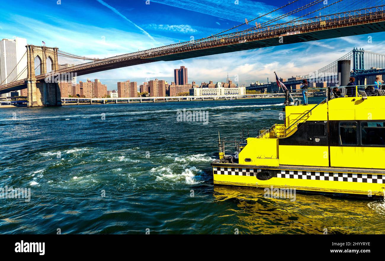 Yellow ferry in New York City under Brooklyn Bridge Stock Photo - Alamy