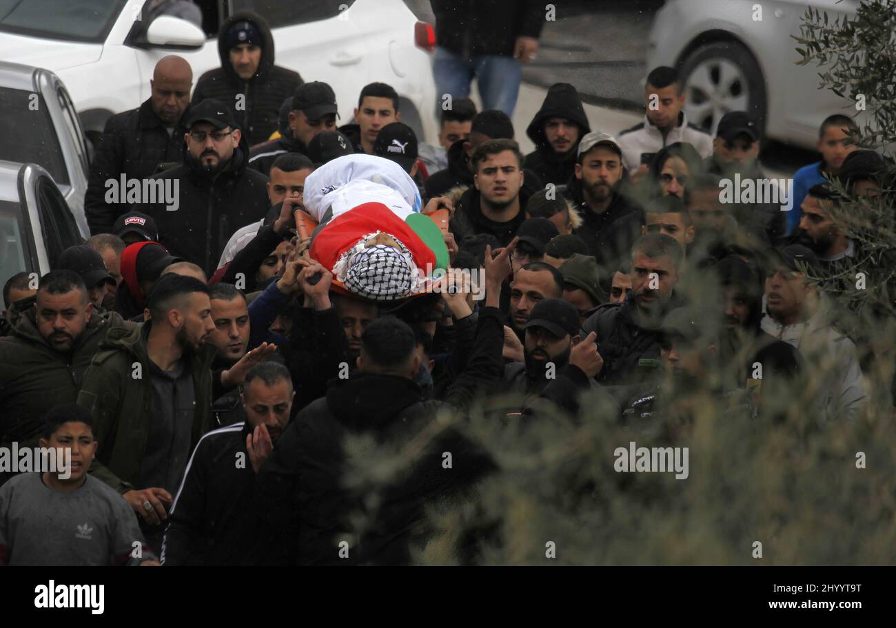 (EDITORS NOTE: Image depicts death) Mourners carry the body of 16-year ...