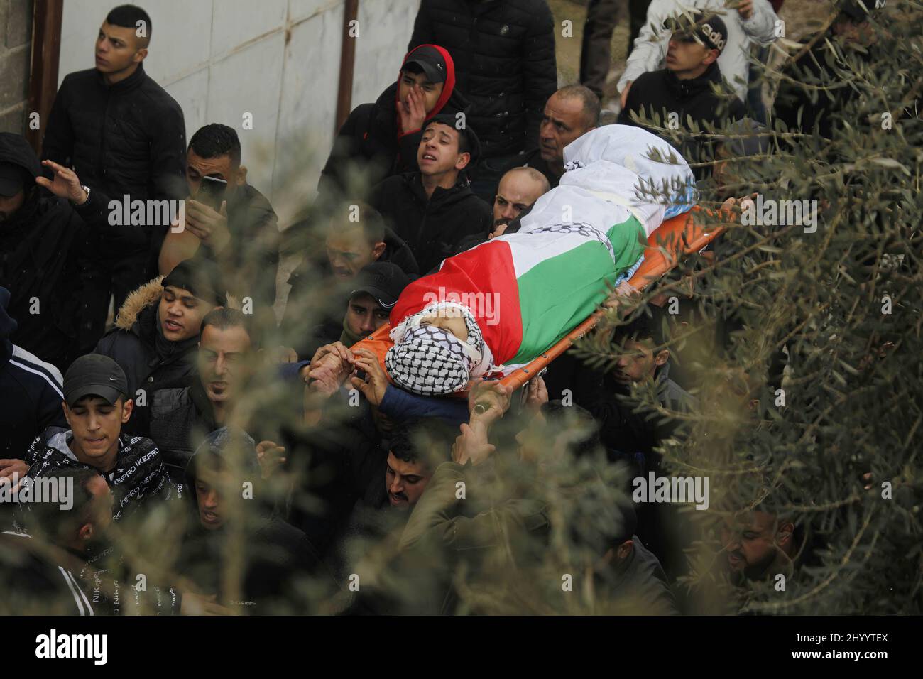 (EDITORS NOTE: Image depicts death) Mourners carry the body of 16-year ...