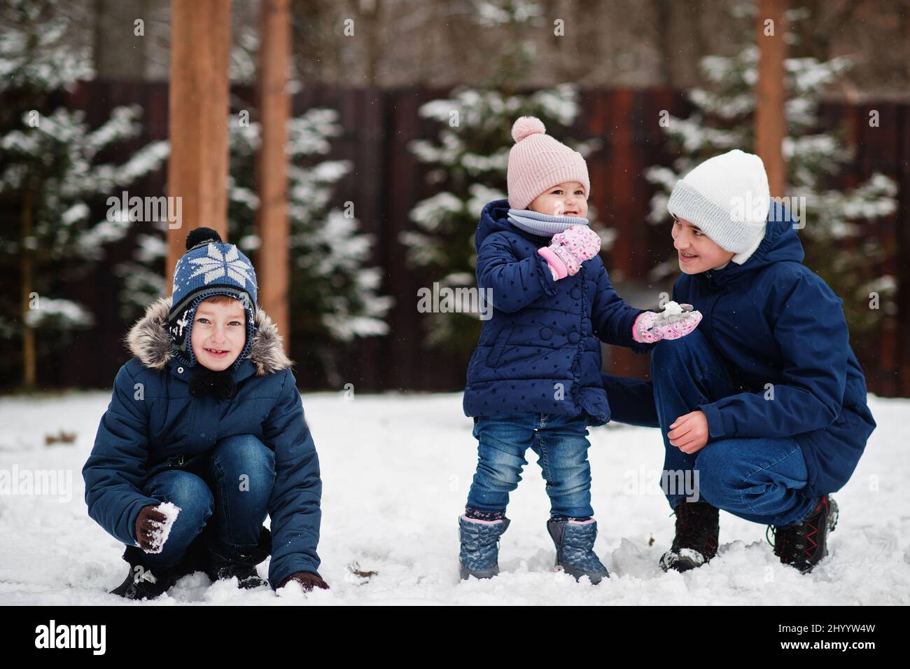 Three kids playing in winter day. Brothers with yongest sister Stock ...