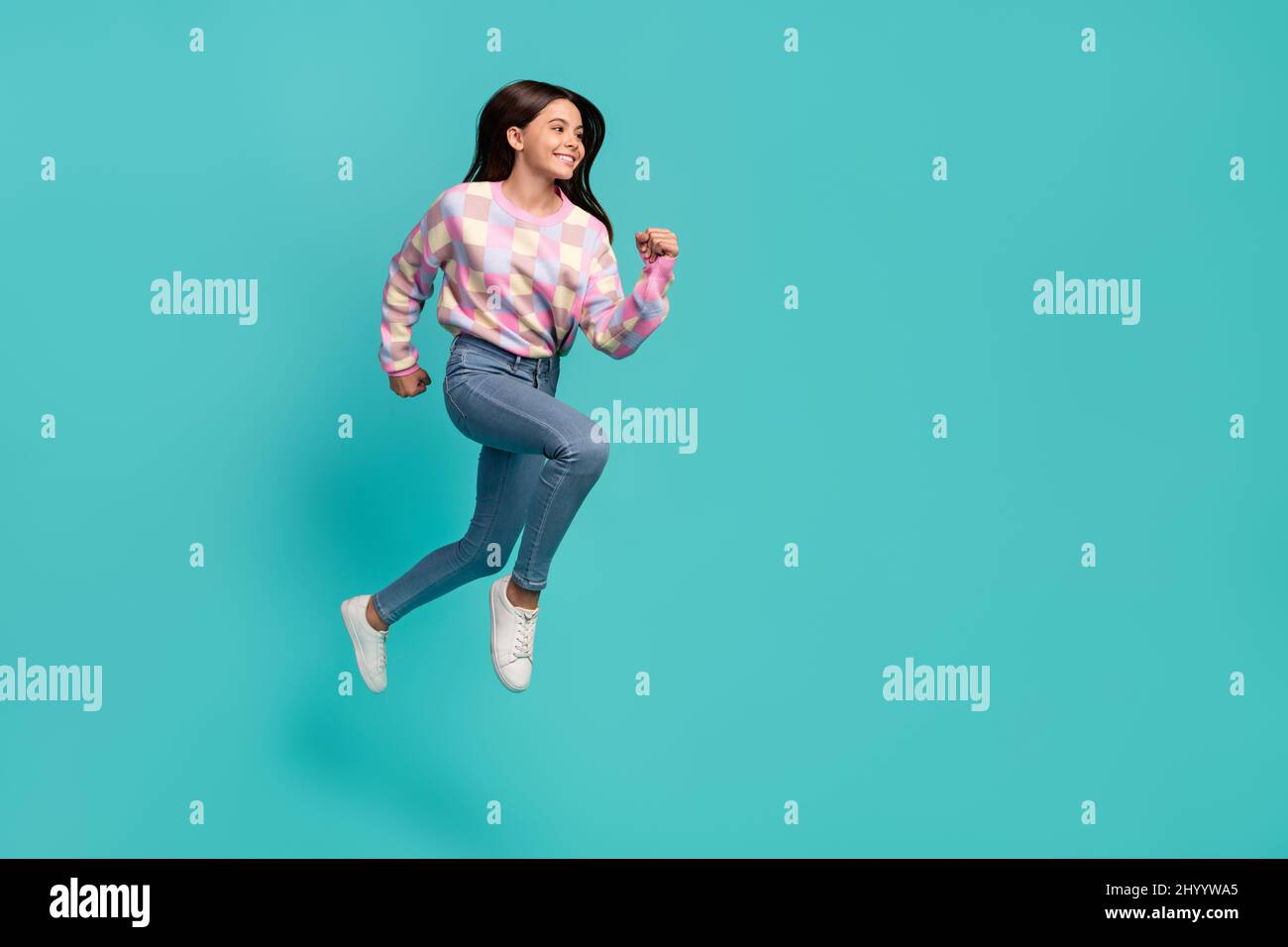 Full length body size view of attractive cheerful girl jumping running ...
