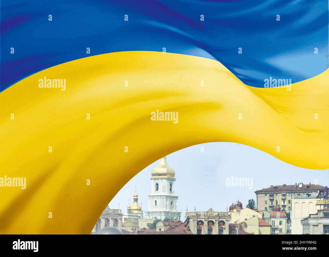 a waving ukrainian flag over the city of kiev. a symbol of the ...