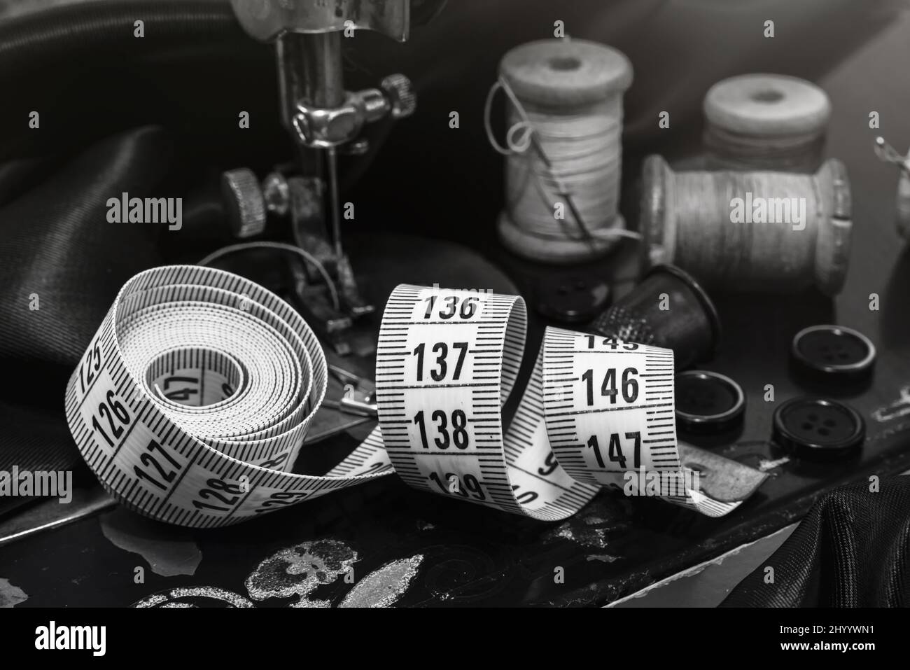 Retro tools for cutting and sewing. Needle with thread, thimble, sewing ...