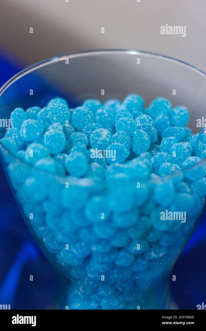 Blue jelly gummies in a glass vase at a celebration Stock Photo - Alamy