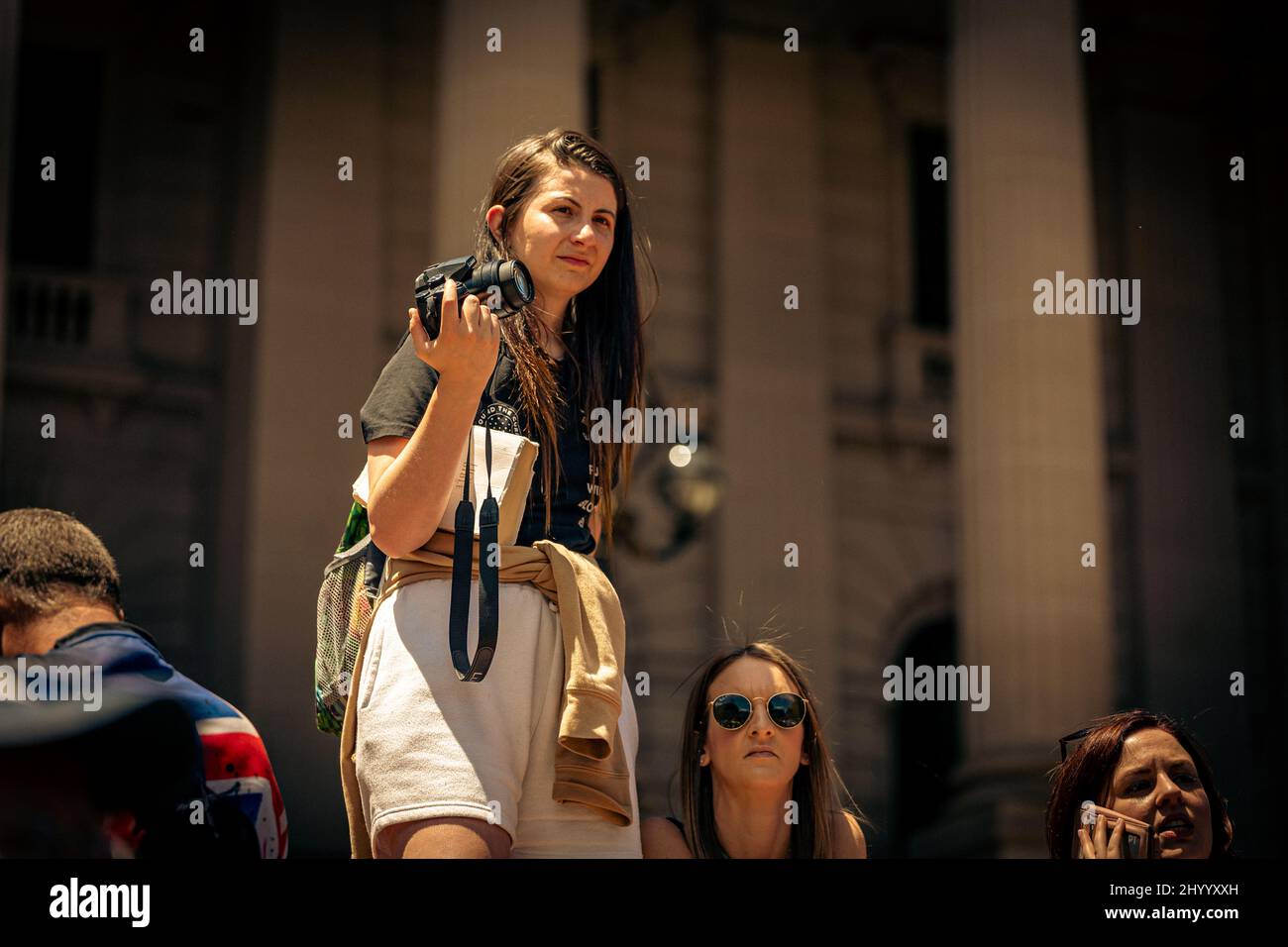 Female photographer on the freedom day protest in Melbourne, Australia ...