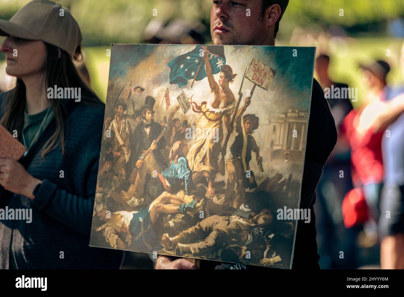 Person holding a painting on the freedom day protest in Melbourne ...