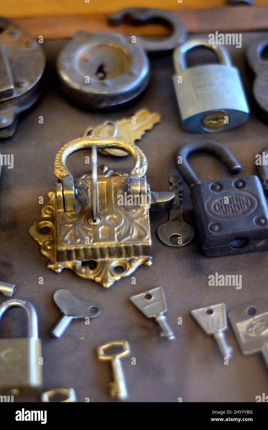 A selection of antique and vintage locks on display at a locksmith shop ...