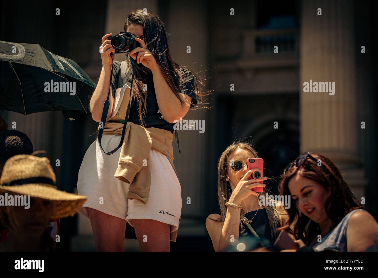 Female photographer on the freedom day protest in Melbourne, Australia ...