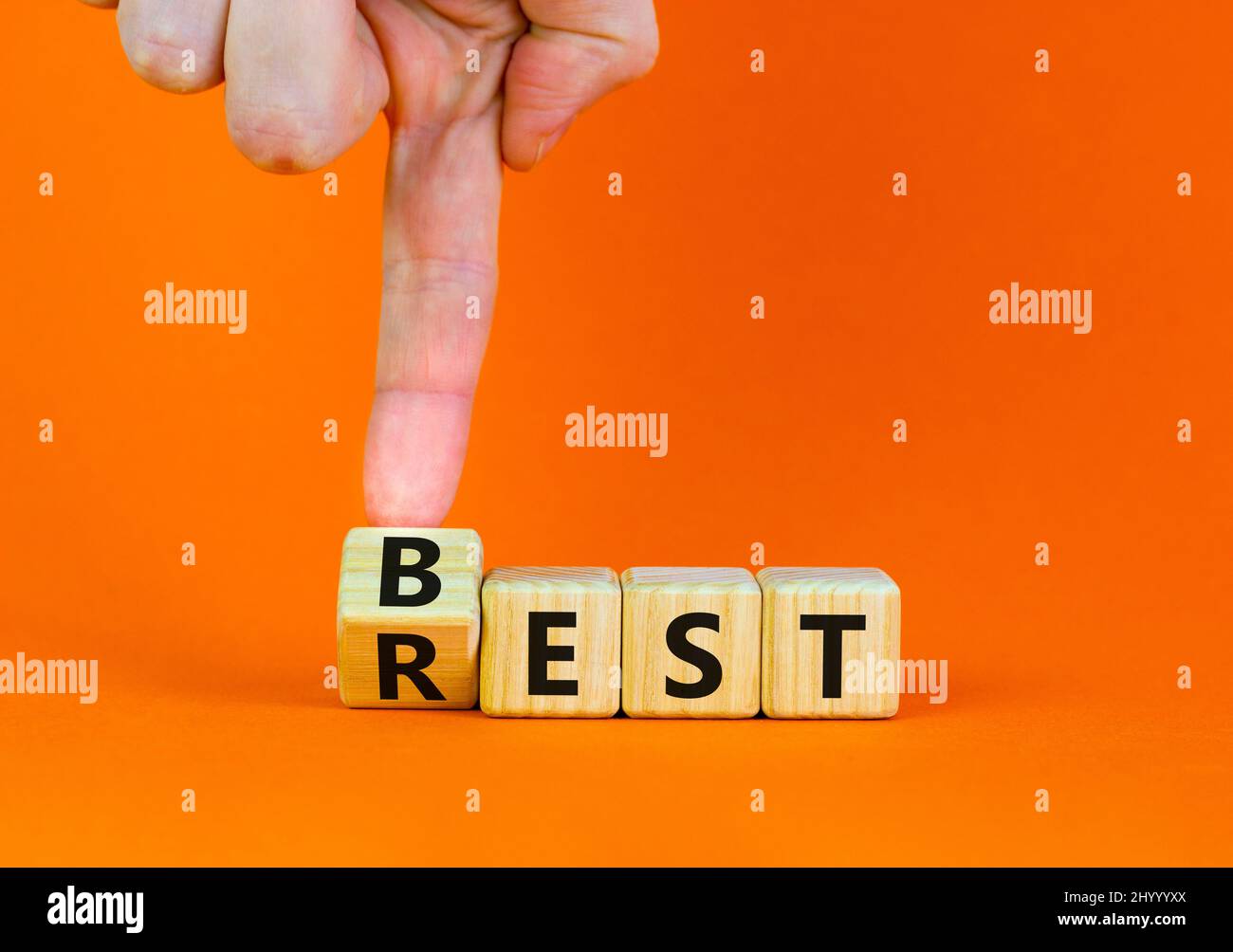 Best rest symbol. Businessman turns wooden cubes and changes the word ...