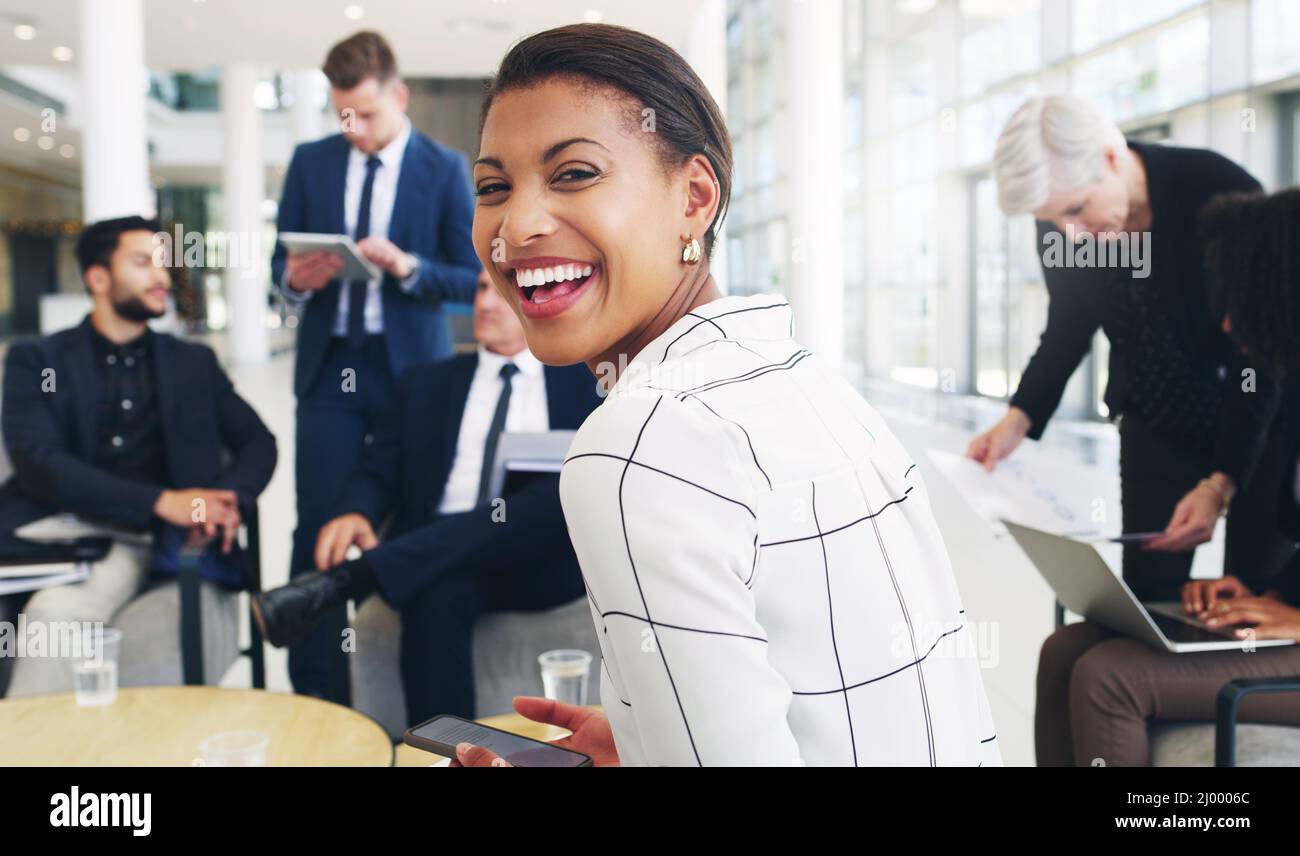 I love my colleagues. Cropped portrait of an attractive young ...