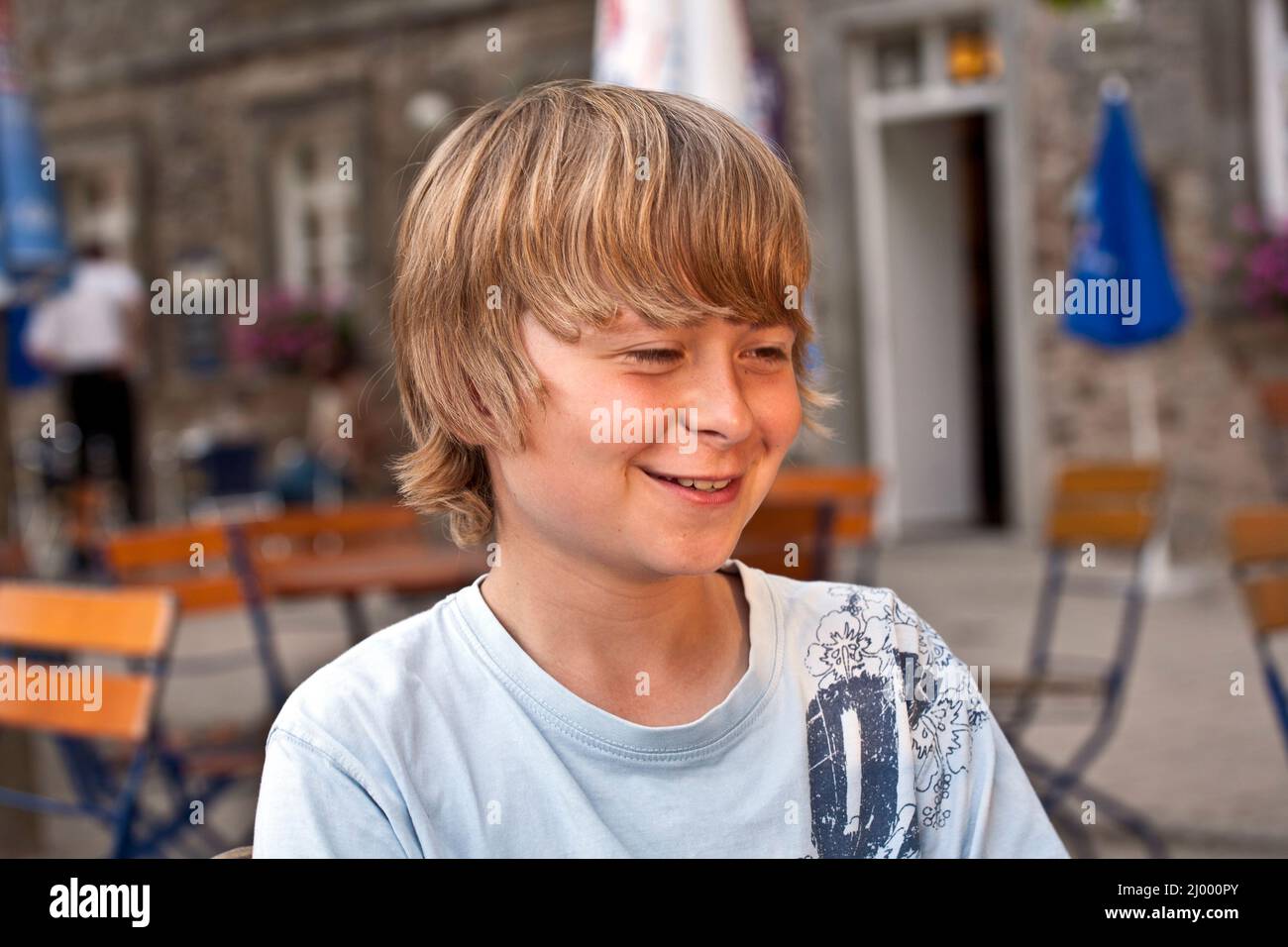 smart smiling boy in a restaurant Stock Photo - Alamy