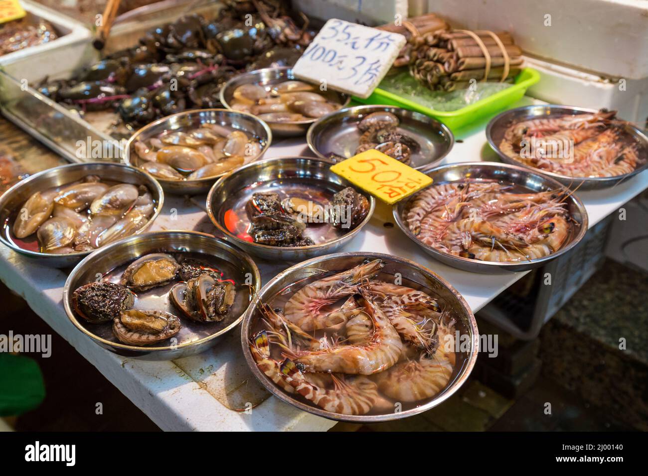 Clams, shrimps and other seafood being sold at a wet market in Hong ...