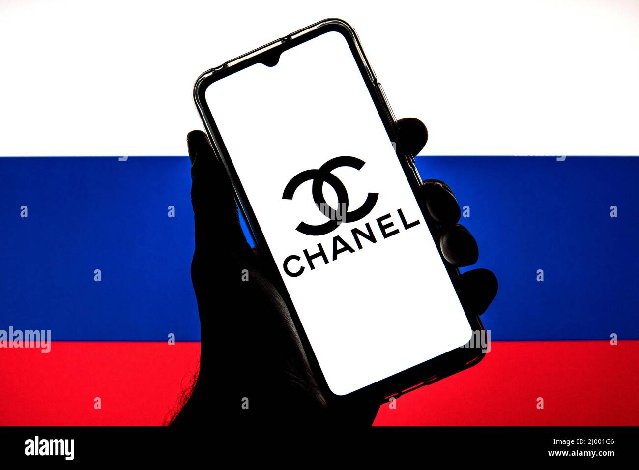 In this photo illustration a Chanel logo seen displayed on a smartphone ...