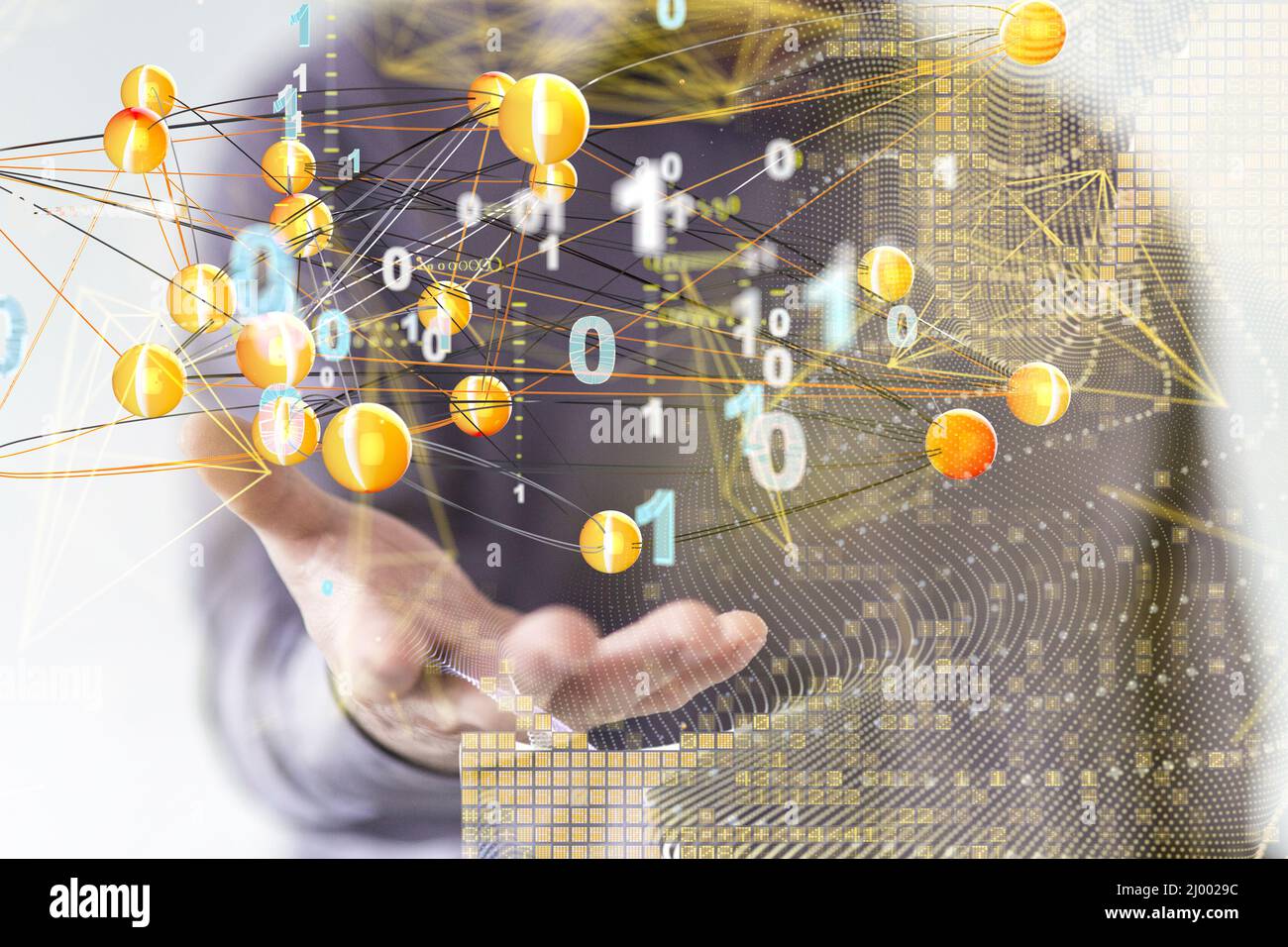 Businessman holding a render of a connected network of binary code ...