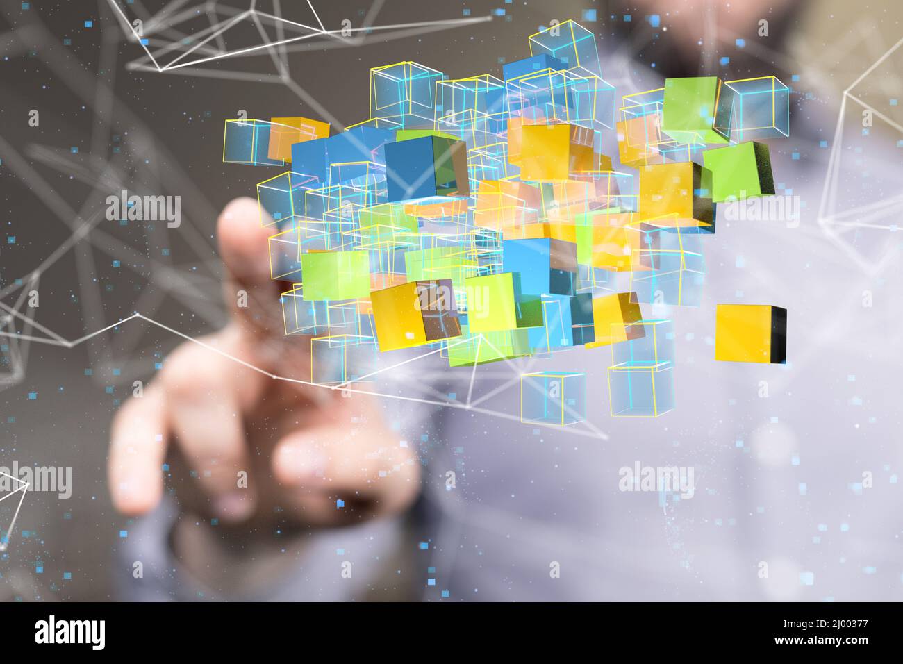 Businessman tapping on a digital render of a floating connected cube ... Businessman tapping on a digital render of a floating connected cube ...