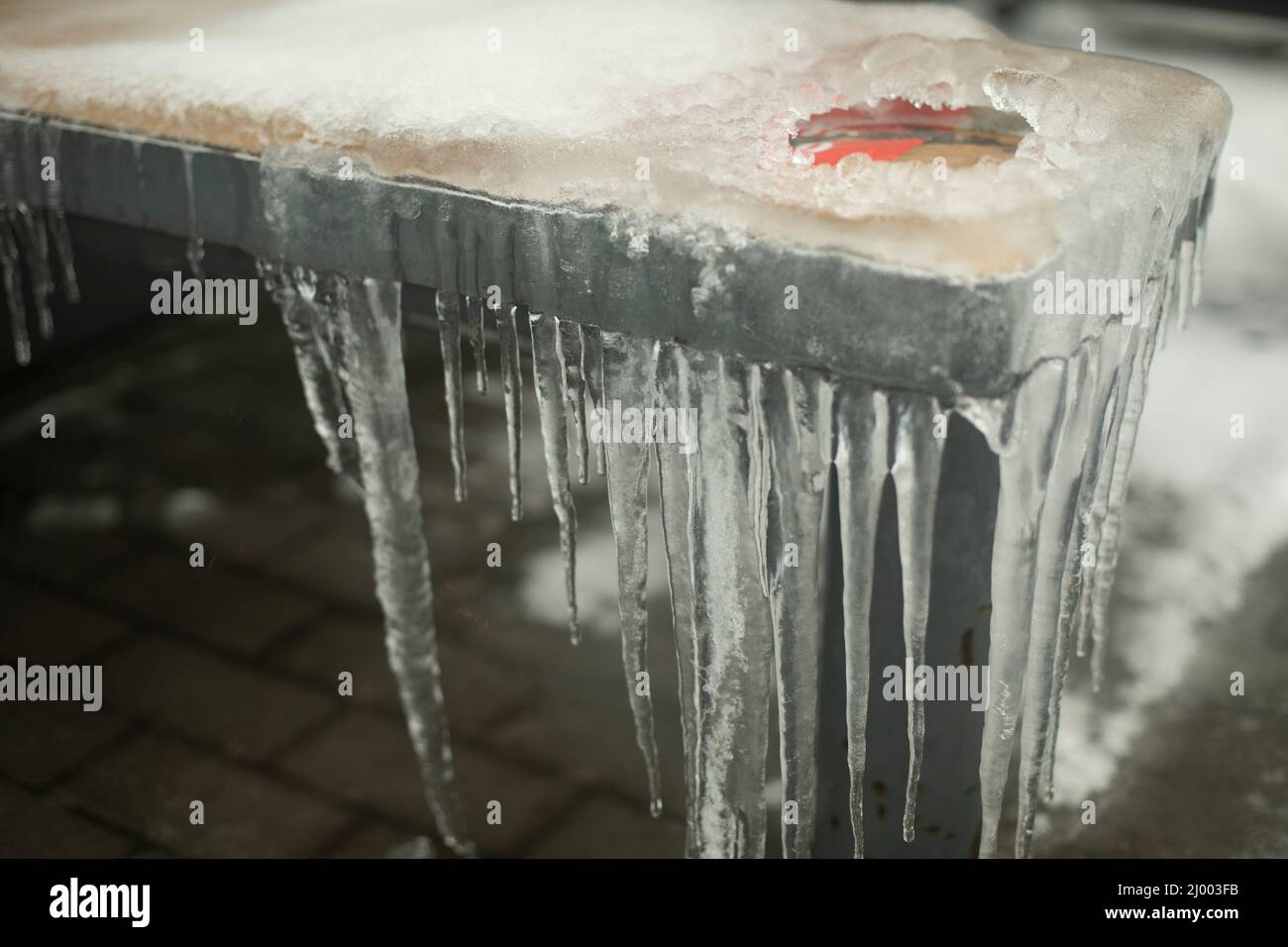 Icy seat. Details of freezing rain Ice outside. Aftermath of storm ...