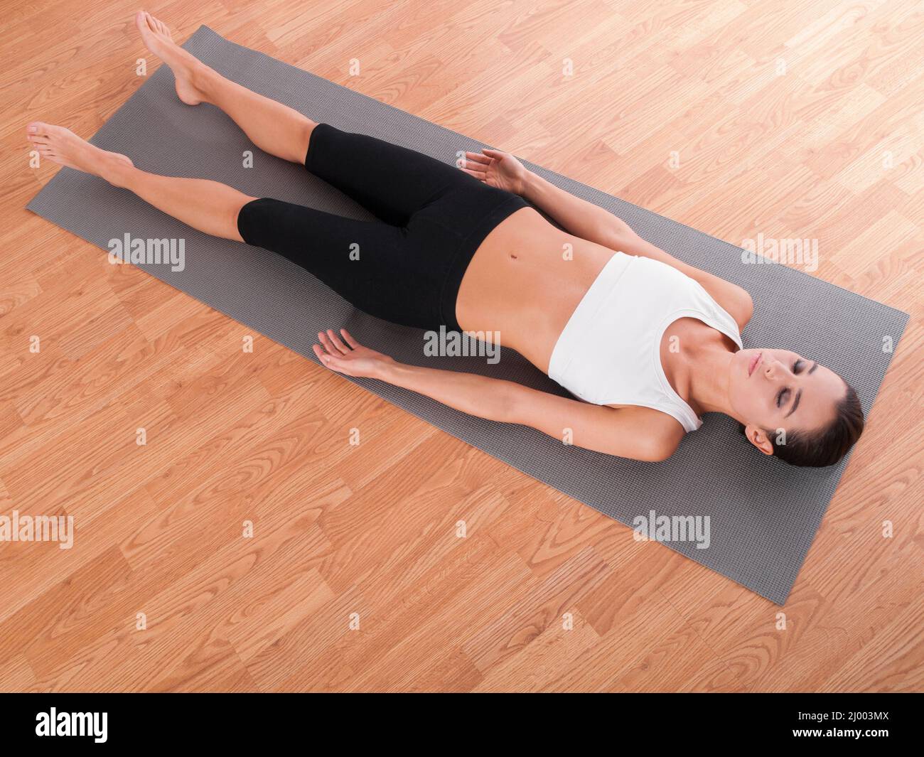 Woman lying on floor gym hi-res stock photography and images - Alamy