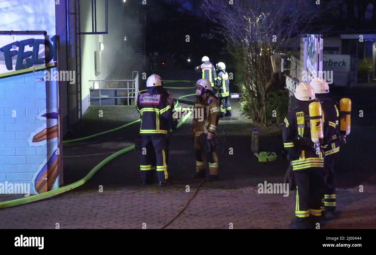 Cologne, Germany. 15th Mar, 2022. Firefighters stand in the Cologne Zoo ...
