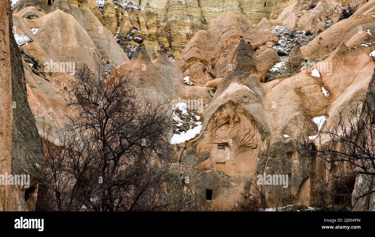 Low angle shot of stone formations and fairy chimneys in Cappadocia ...