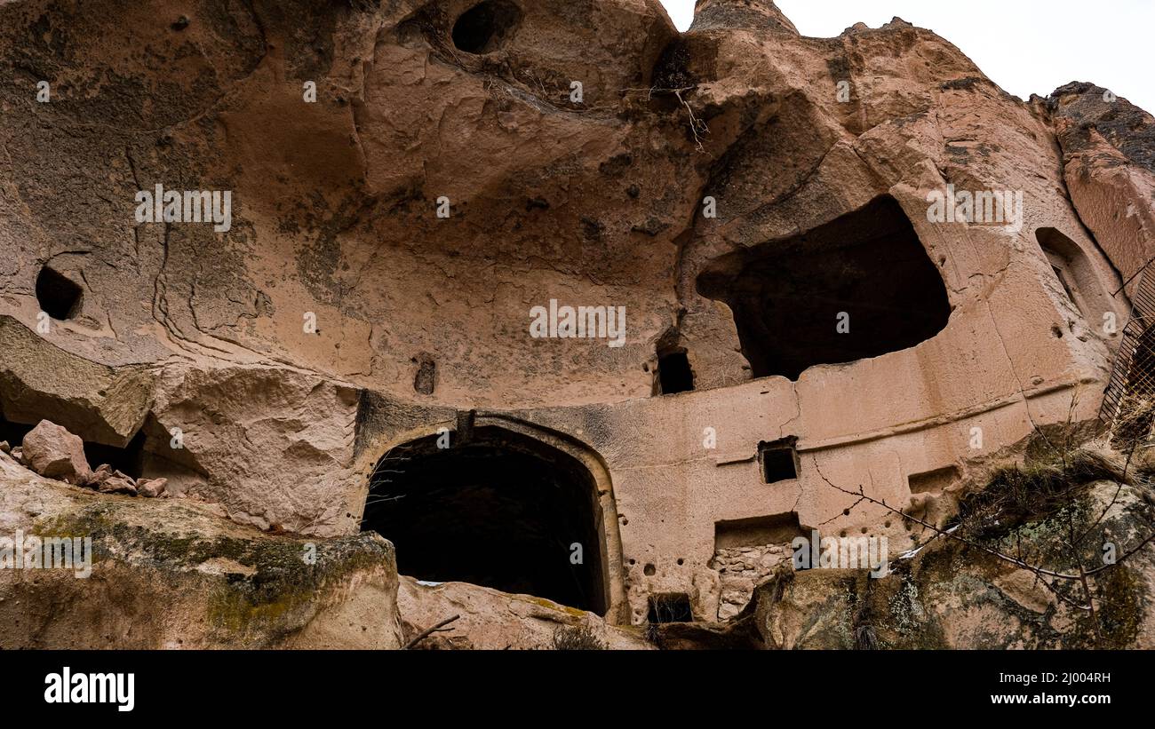 Low angle shot of stone formations and fairy chimneys in Cappadocia ...