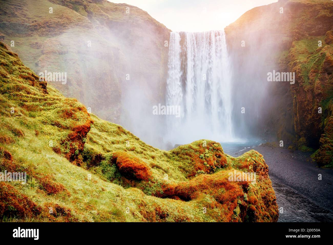 Lovely view of famous Skogafoss waterfall and scenic surroundings ...