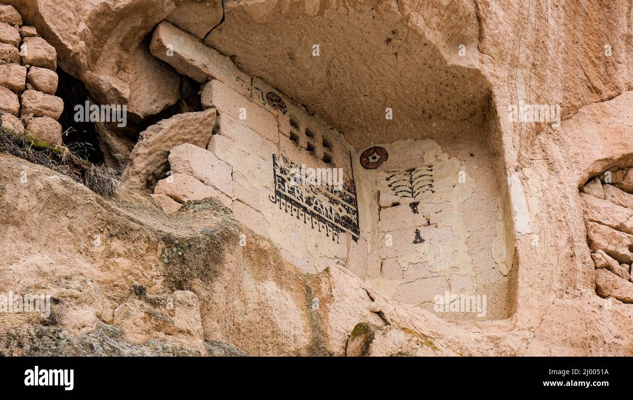 Low angle shot of stone formations and fairy chimneys in Cappadocia ...