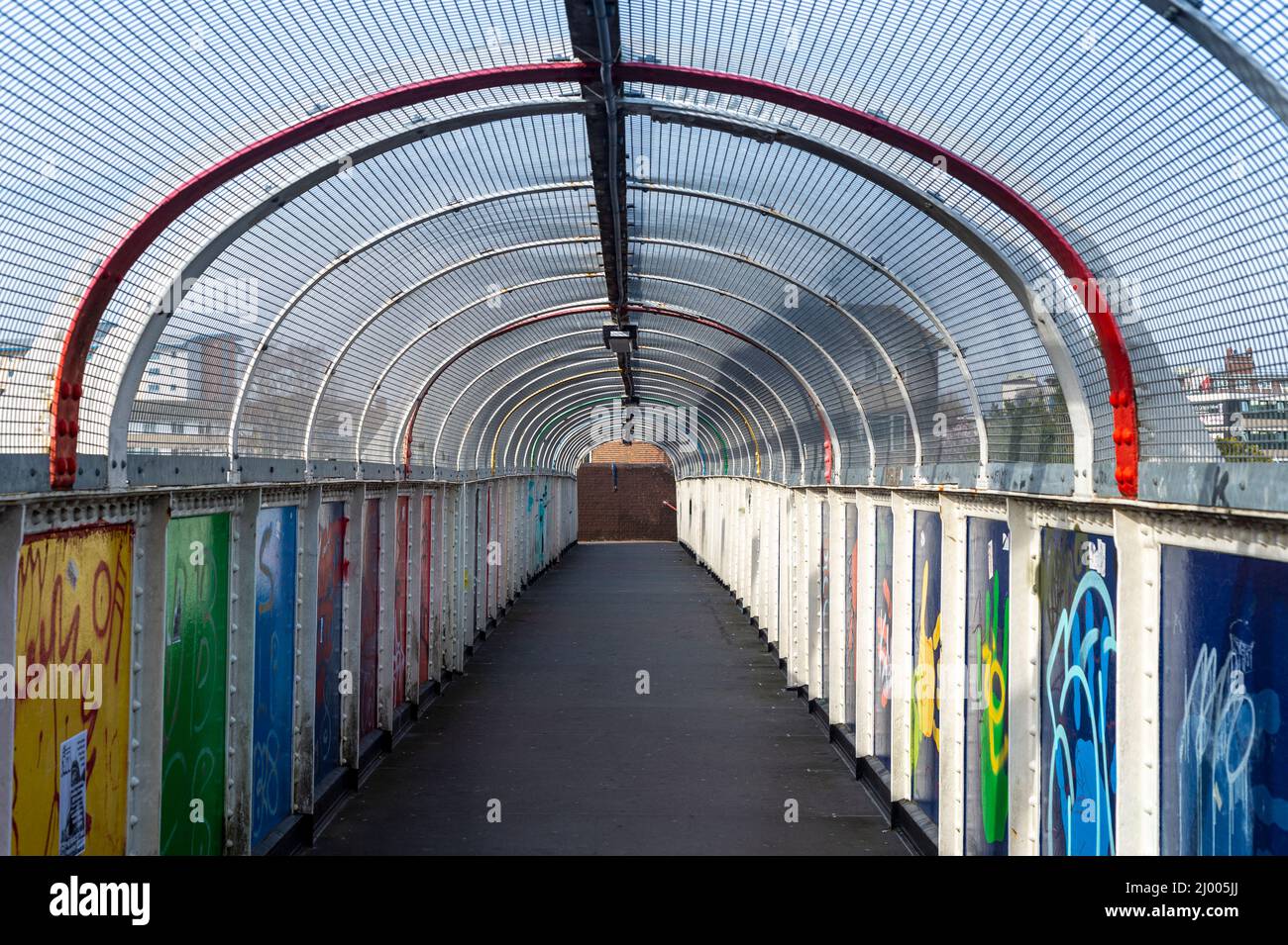 Metal footbridge over a railway. Perspective Stock Photo - Alamy