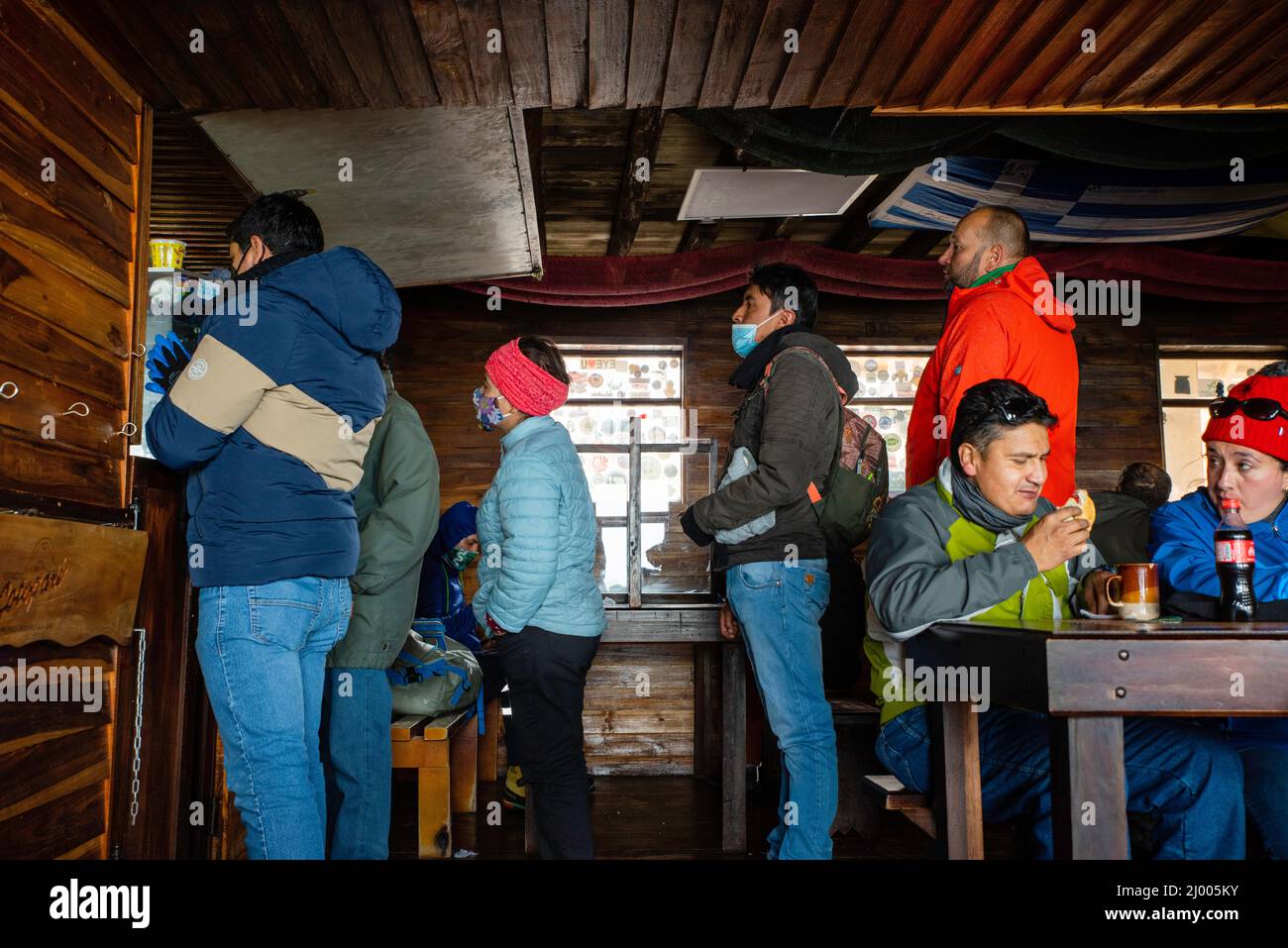 Interior view of Refugio Jos F lix Ribas and tourists eating and ...