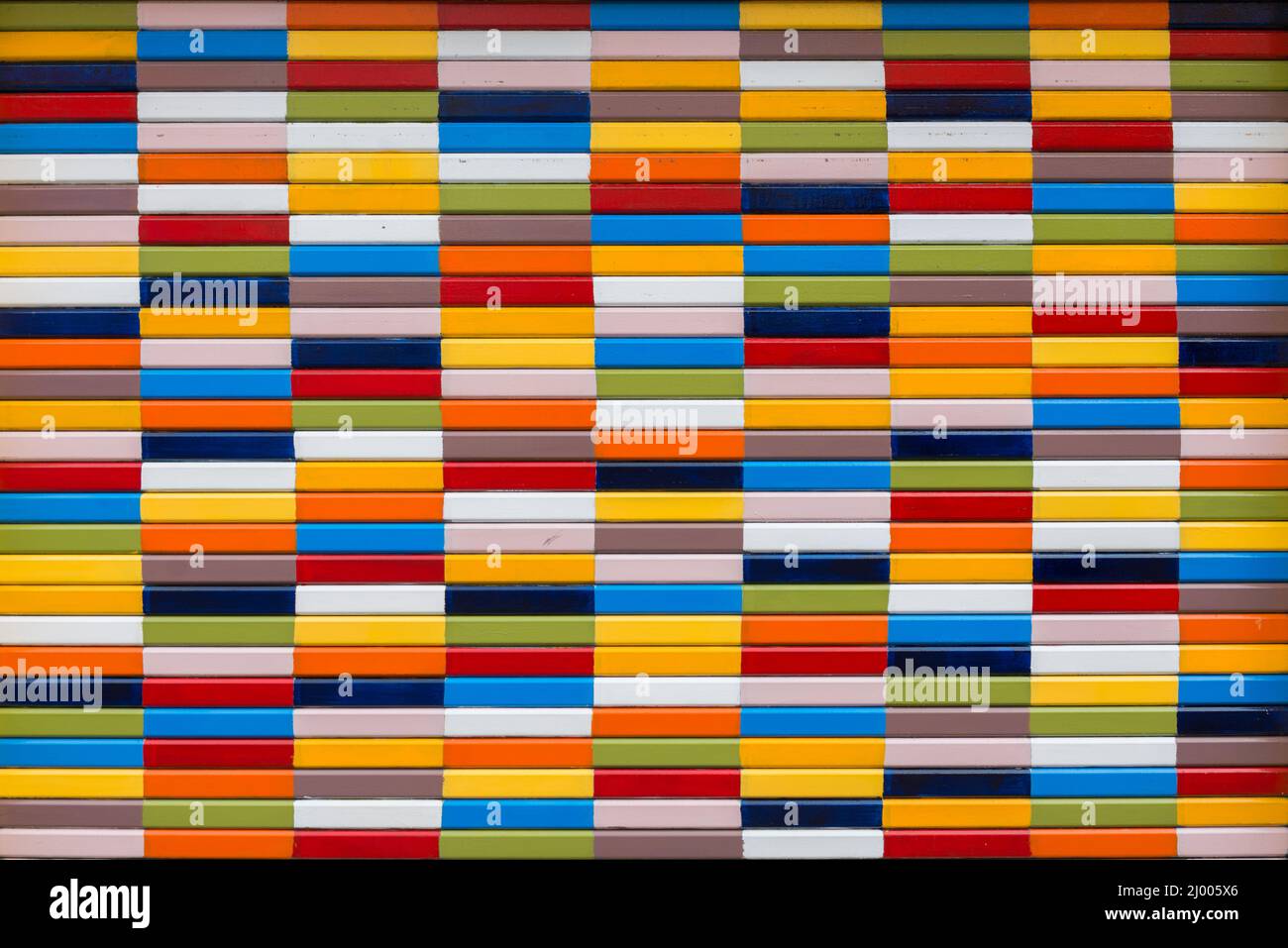 Wall is painted with colorful lines or rectangles. Surface of thin ...