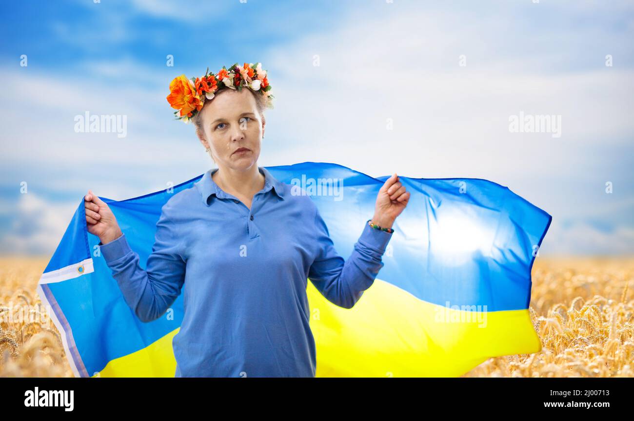 Pray for Ukraine. Crying woman with Ukrainian flag. Sad female in tears ...