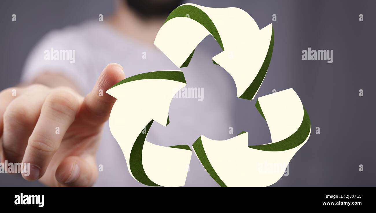 Man's hand clicking on a 3d rendered green recycling symbol Stock Photo ...