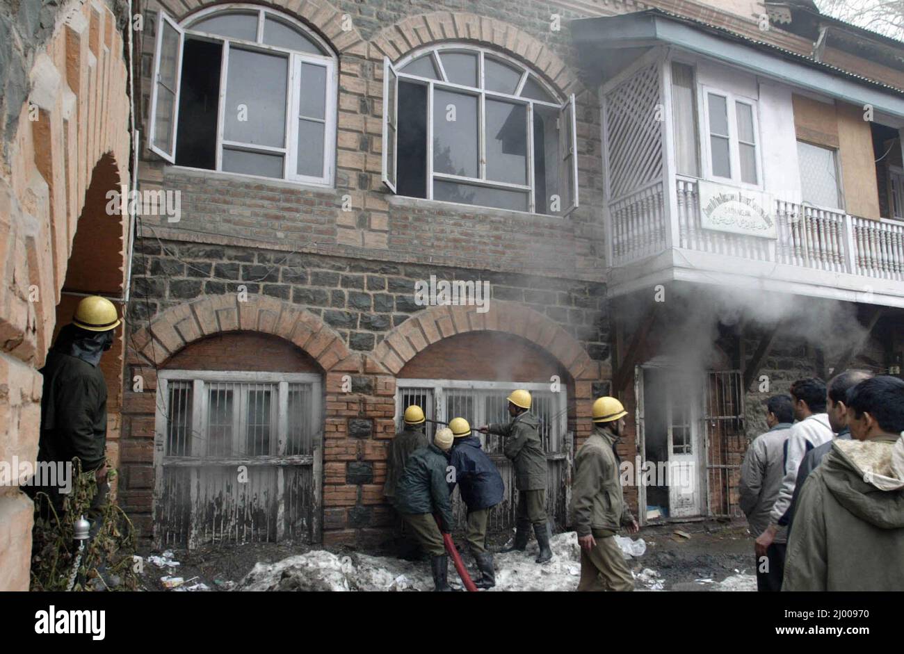 Indian fire fighters try to put out a fire after an accidental ...