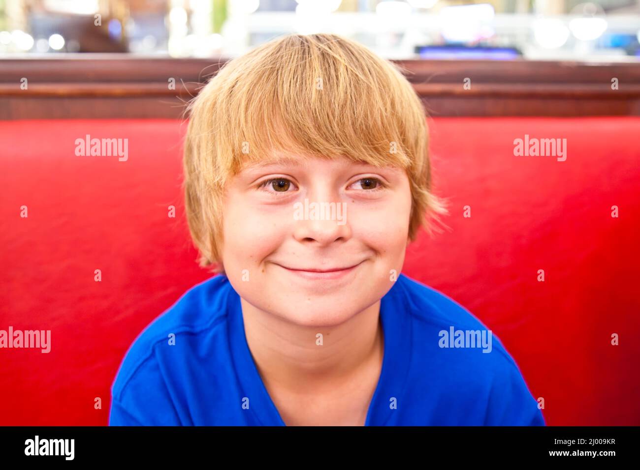 smiling boy in a diners at night Stock Photo - Alamy