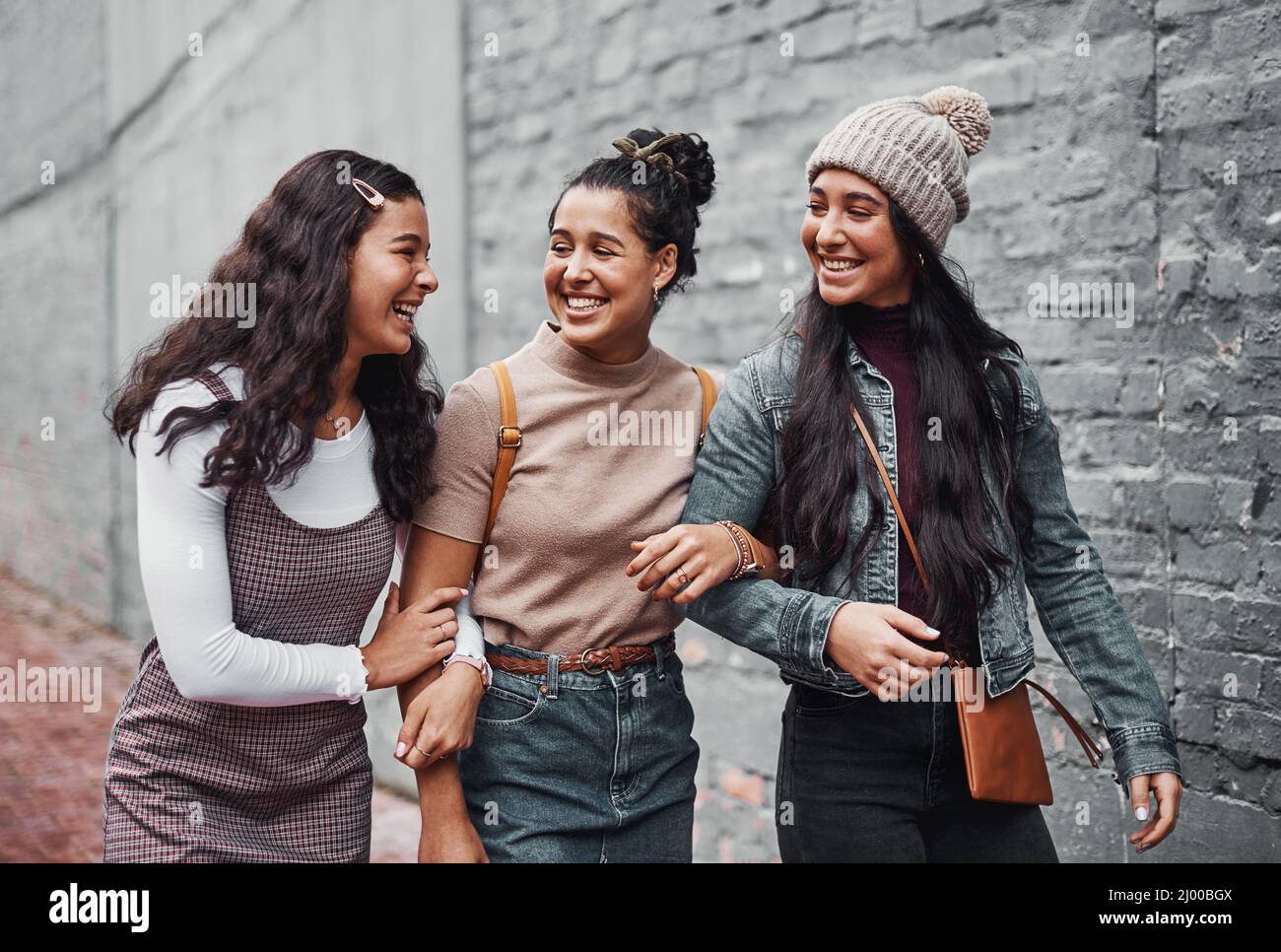 Sister bonding time. Cropped shot of an attractive group of sisters bonding during a day out in ...