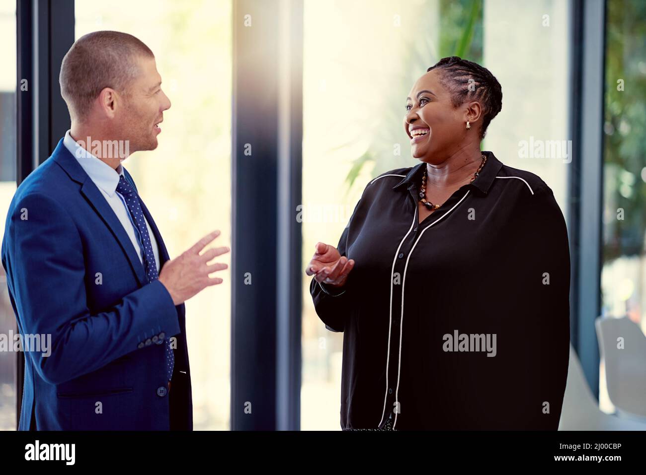 Making beneficial business decisions together. Shot of two ...