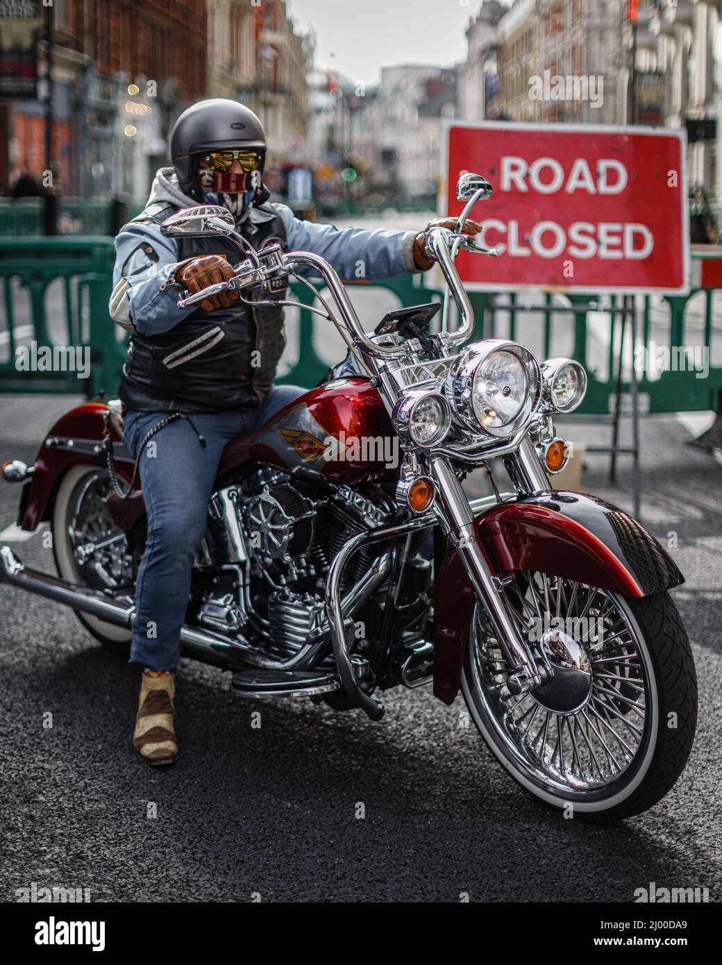 A biker poses on a Harley Davidson in London's Soho Stock Photo - Alamy