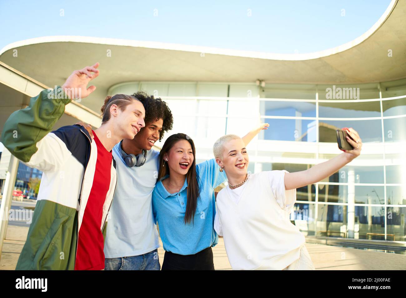 Group of friends having fun in a university campus and taking a selfie ...
