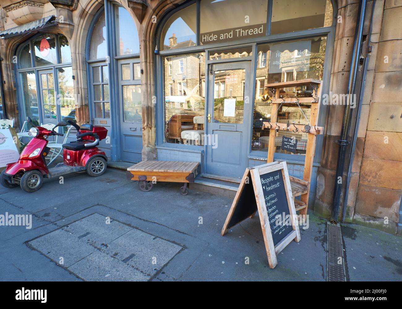 Shop window and pavement scene in Matlock Town, UK Stock Photo - Alamy