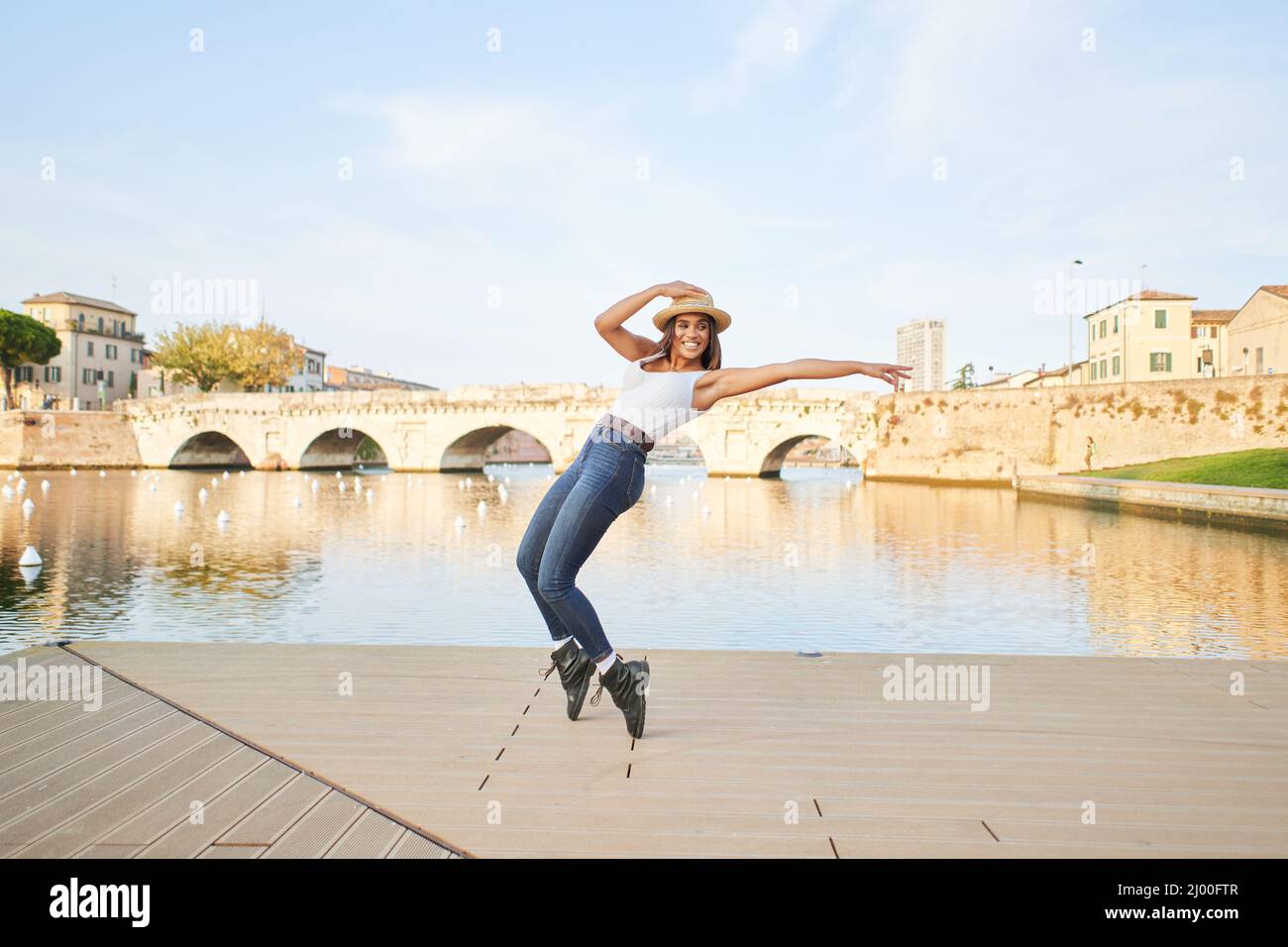 Happy woman having fun together. Young female dancer doing a dance step ...