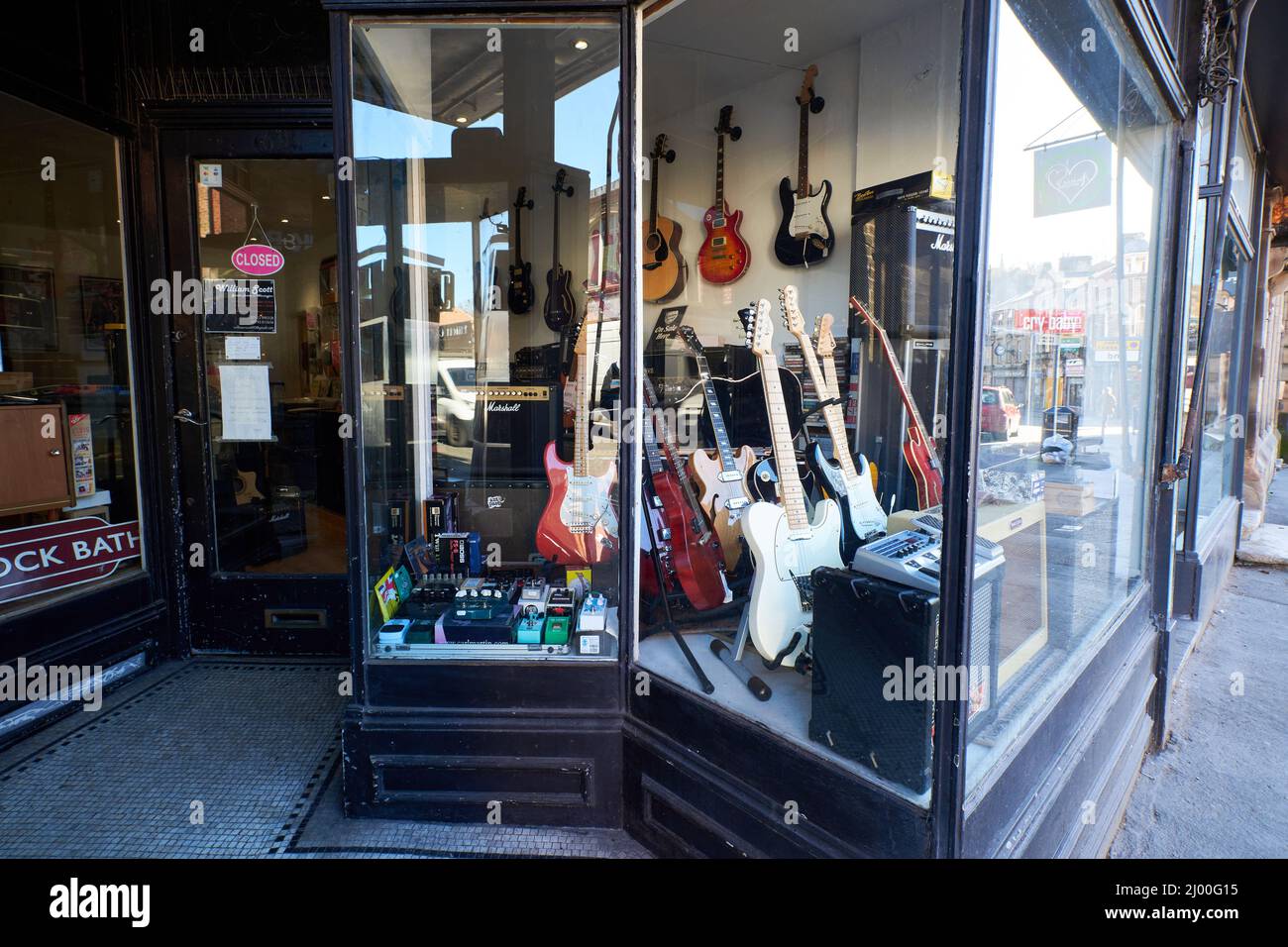 Electric guitars in a store window Stock Photo - Alamy