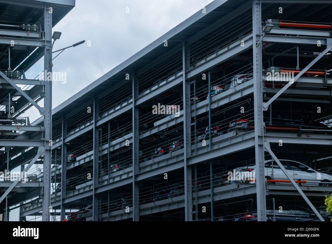 Big multi-level parking full of cars on a gloomy day Stock Photo - Alamy