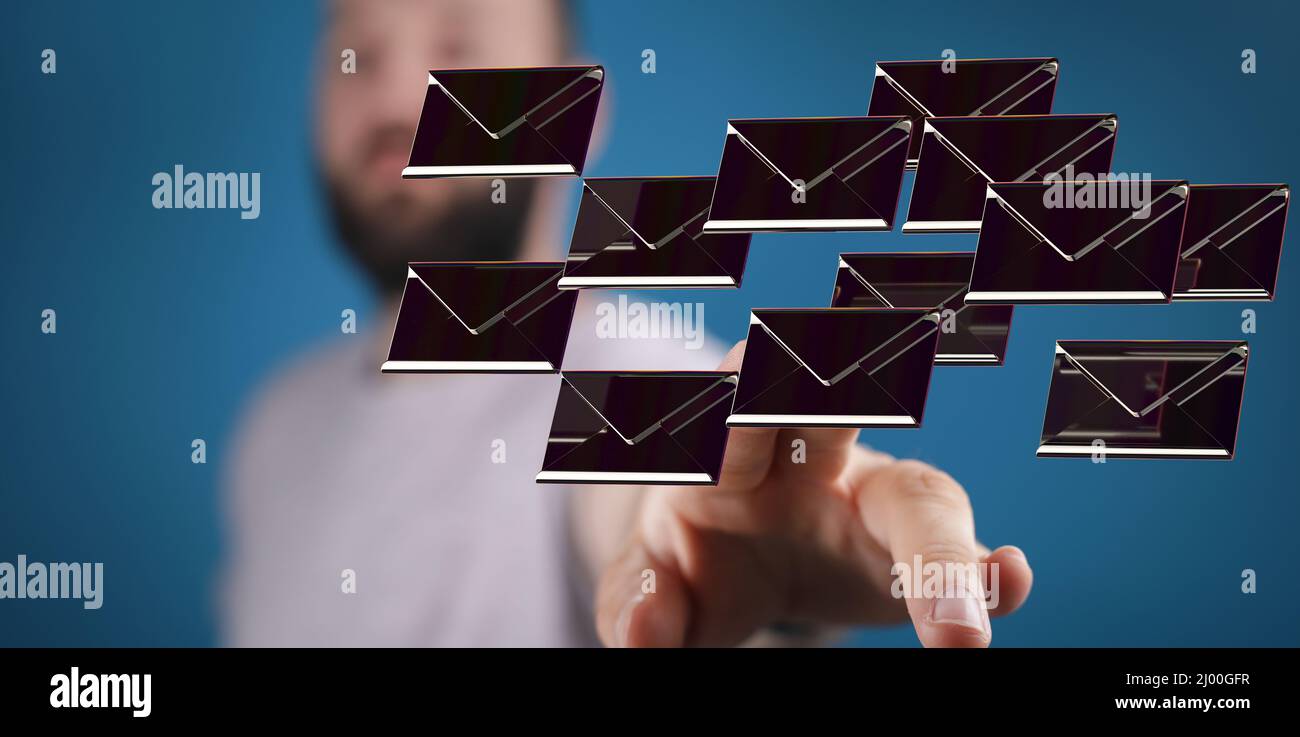 Pointing at flying email icons Stock Photo - Alamy