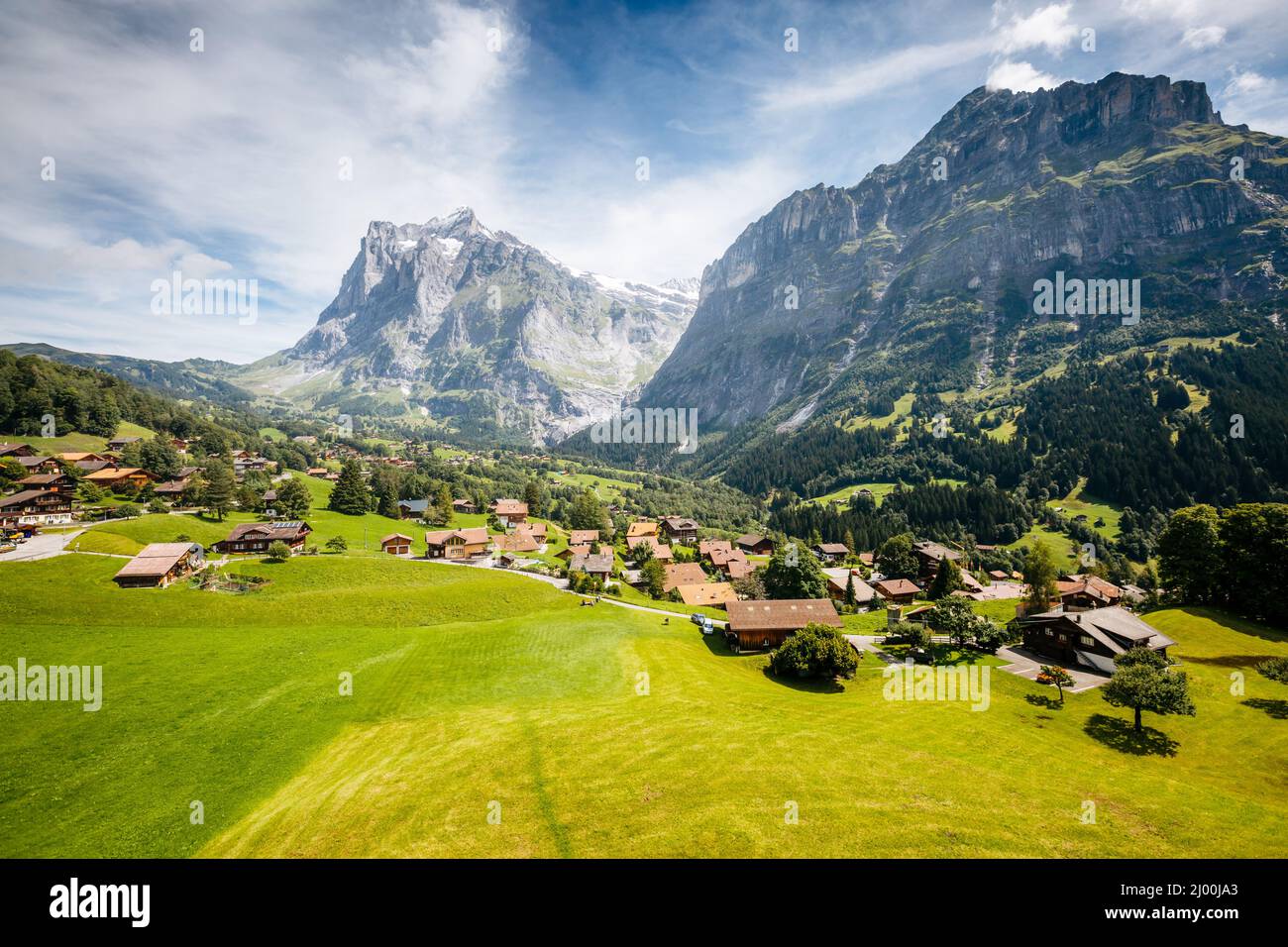 Sunny view of alpine Eiger village. Picturesque scene. Popular tourist ...