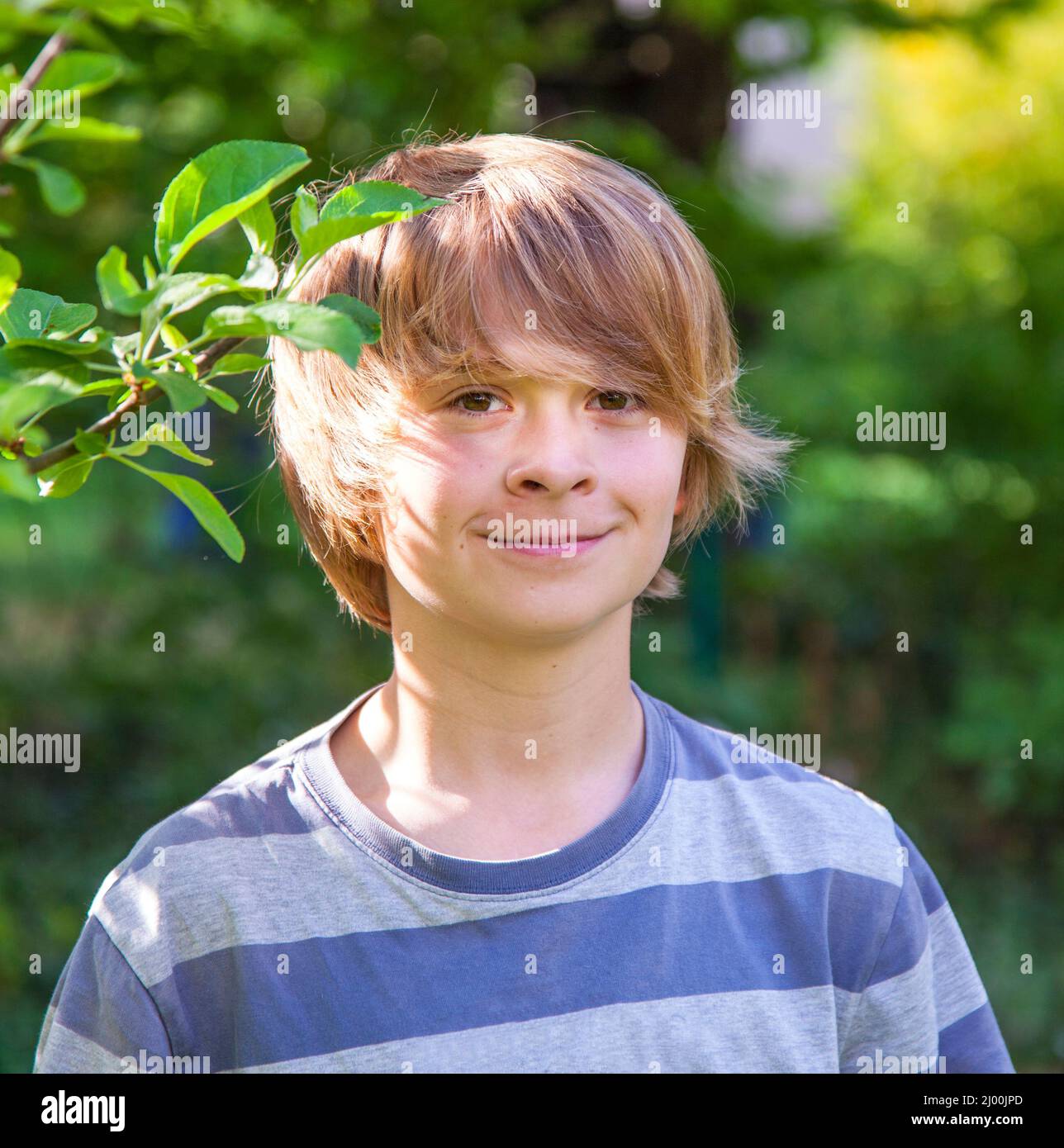 cute smiling boy with cheeky smile Stock Photo - Alamy