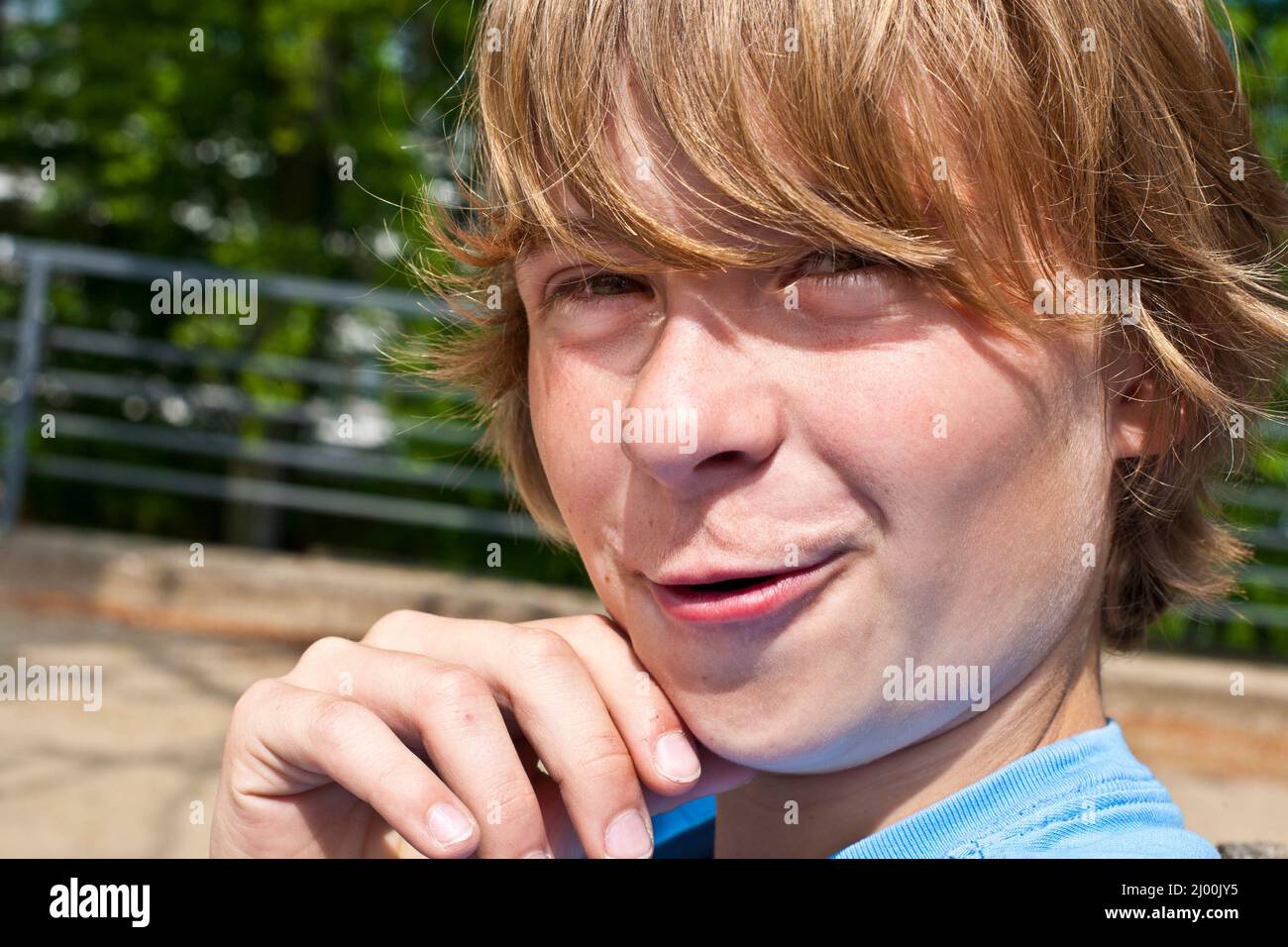 cute smiling boy with cheeky smile Stock Photo - Alamy