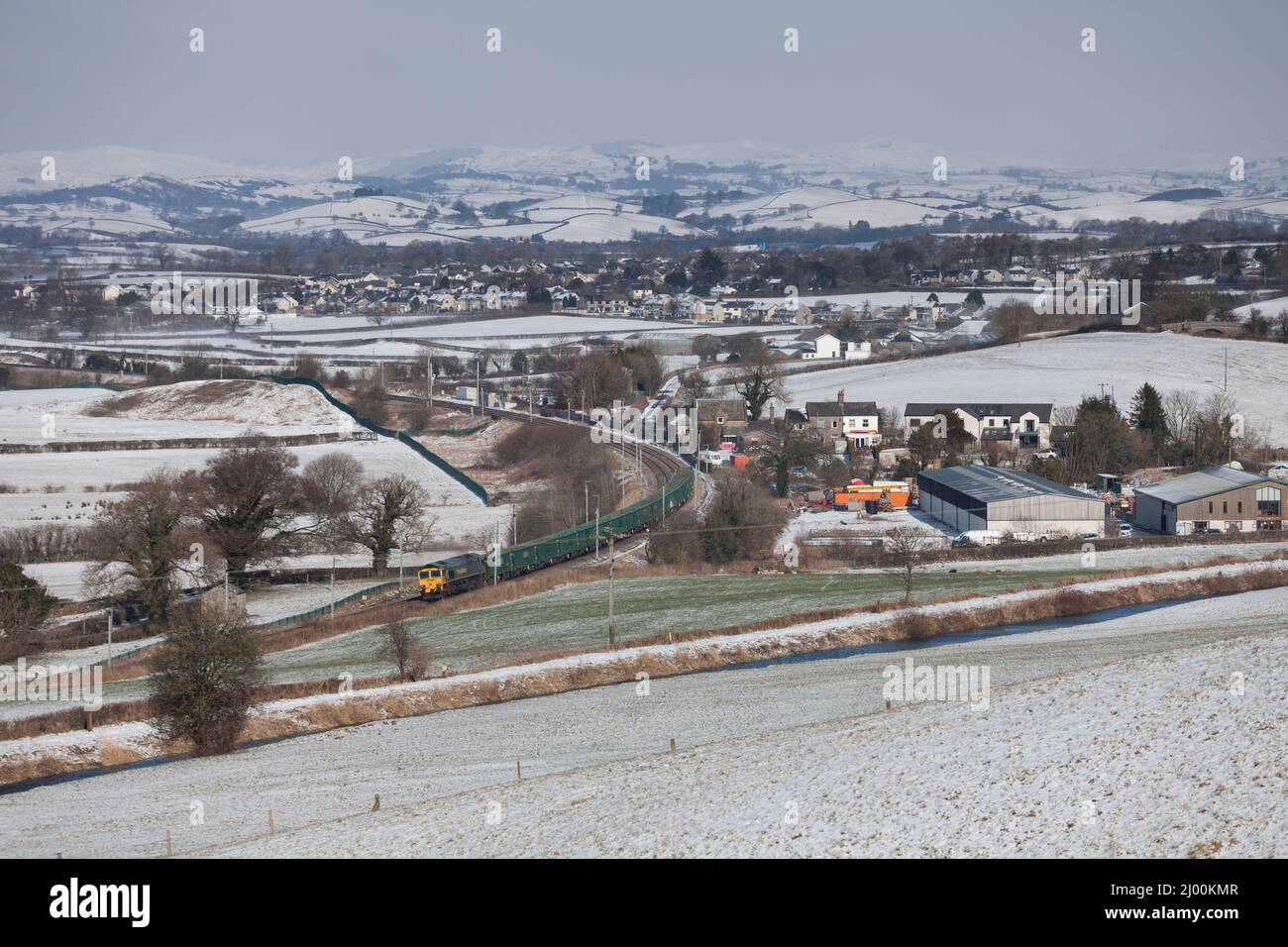 Freightliner aggregates freight train running through the countryside ...