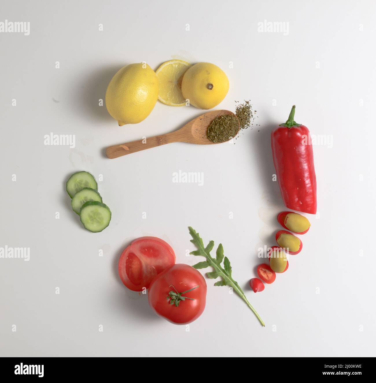 Green olives with hot red chilly composition with copy space on white ...