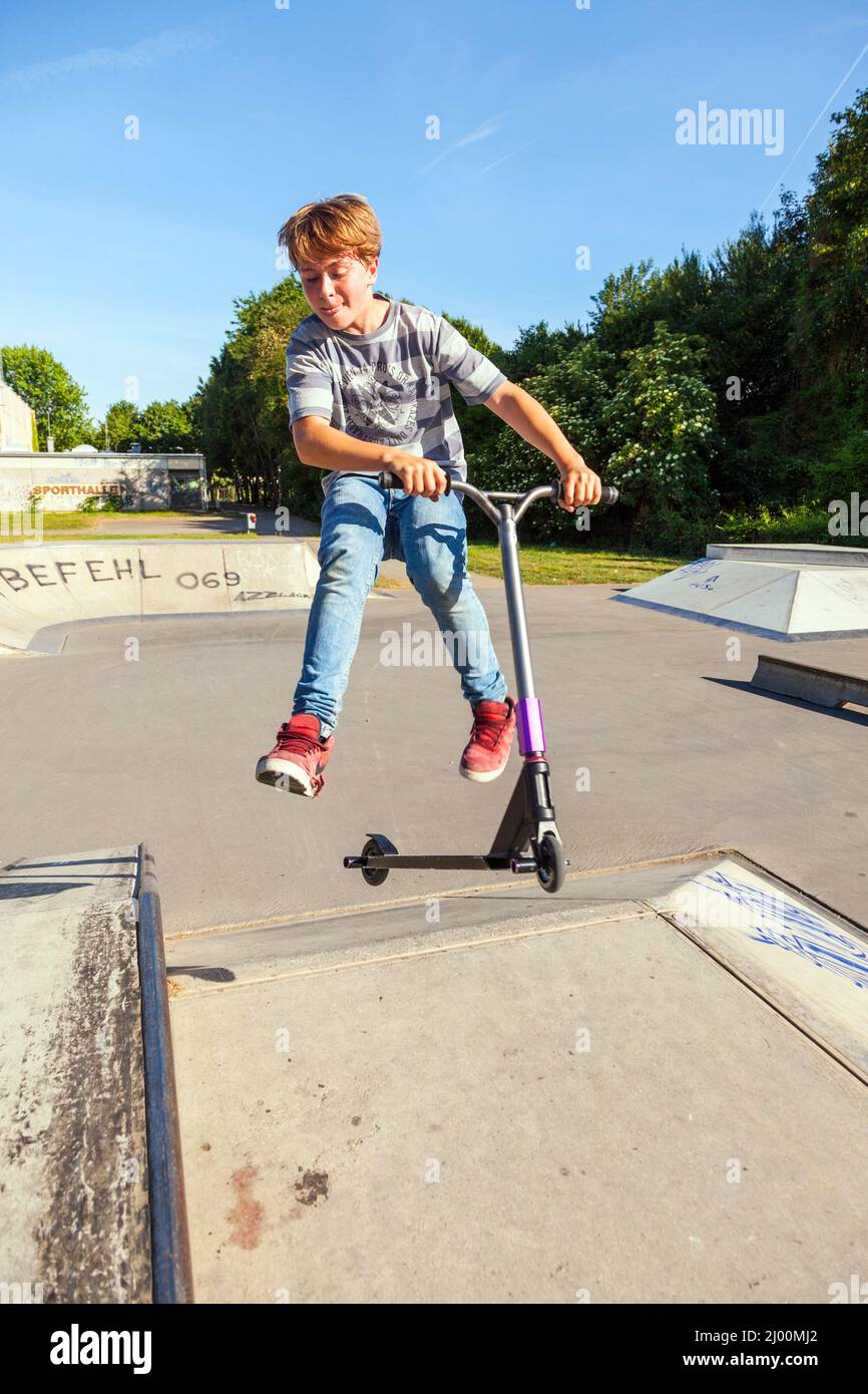 Children play outdoors jumping over hi-res stock photography and images ...